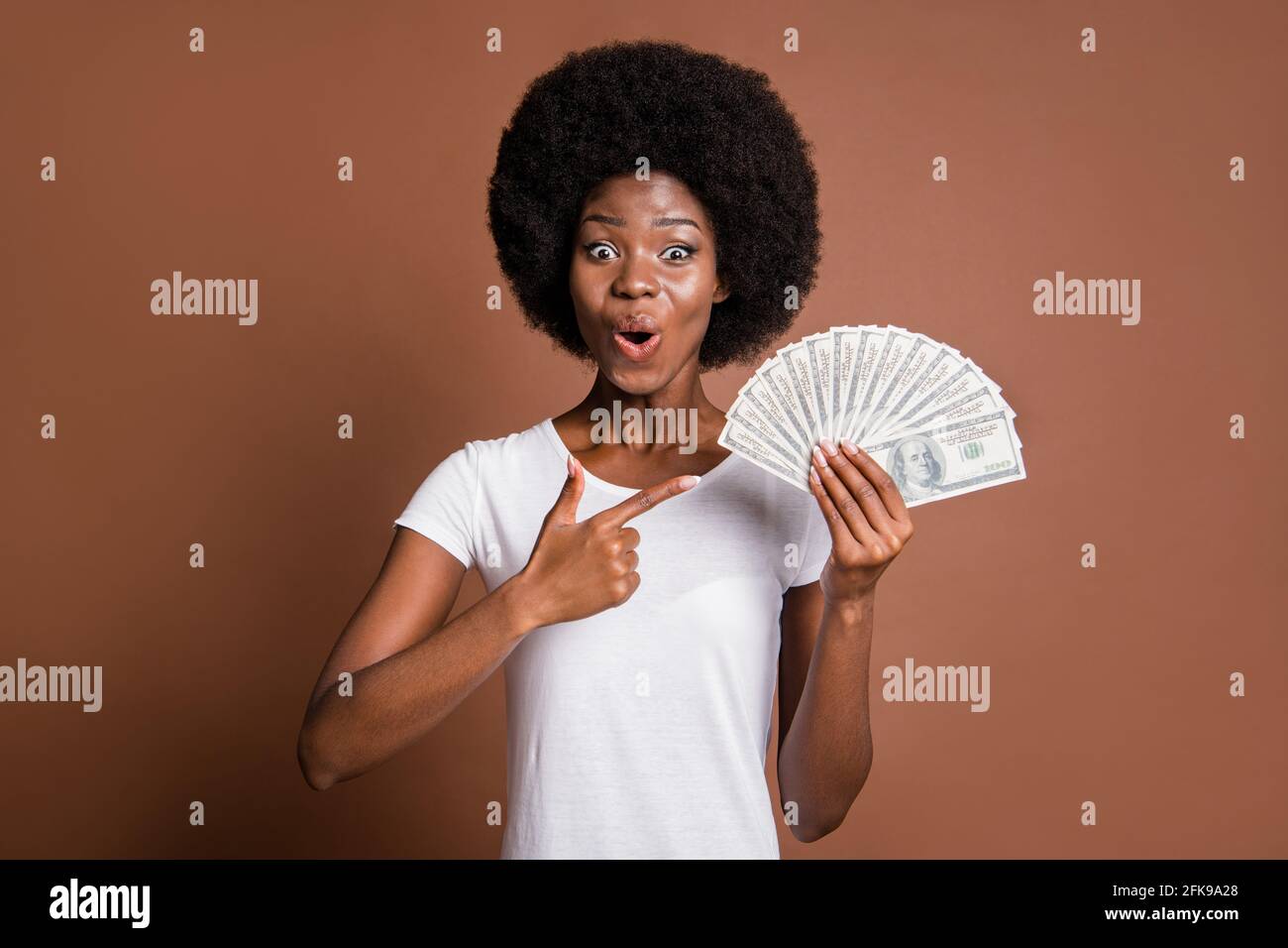 Photo portrait of woman pointing finger money cash dollar banknotes ...