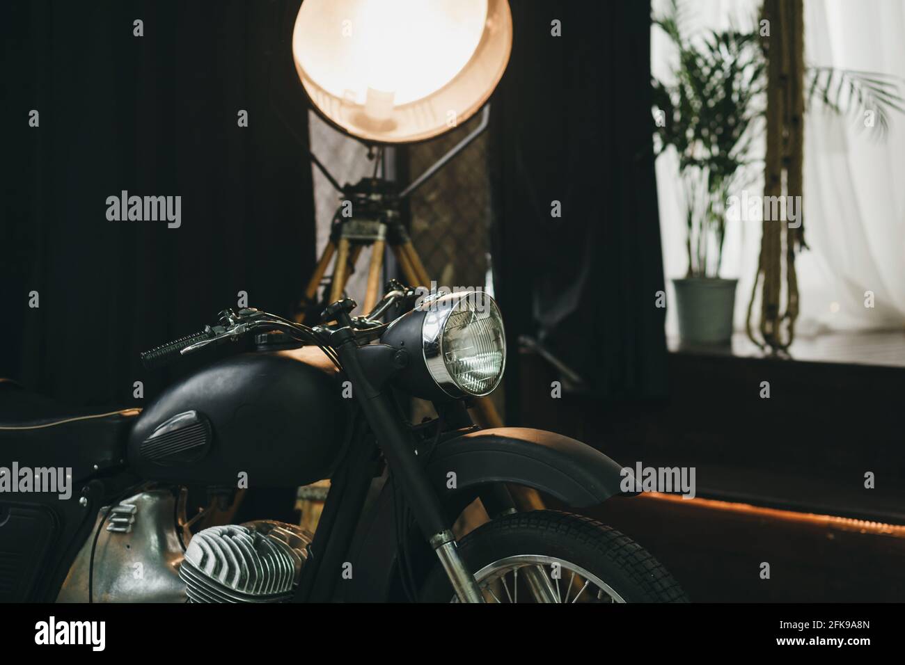 vintage motorcycle in a classic interior. men's room style Stock Photo ...