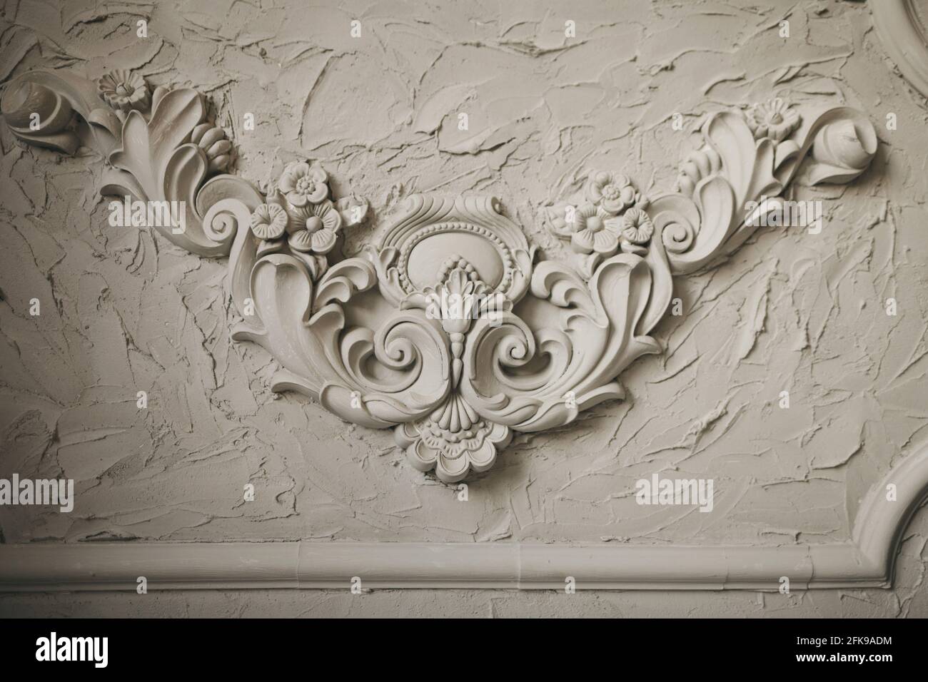 Plaster background floral pattern. antique decor Stock Photo - Alamy