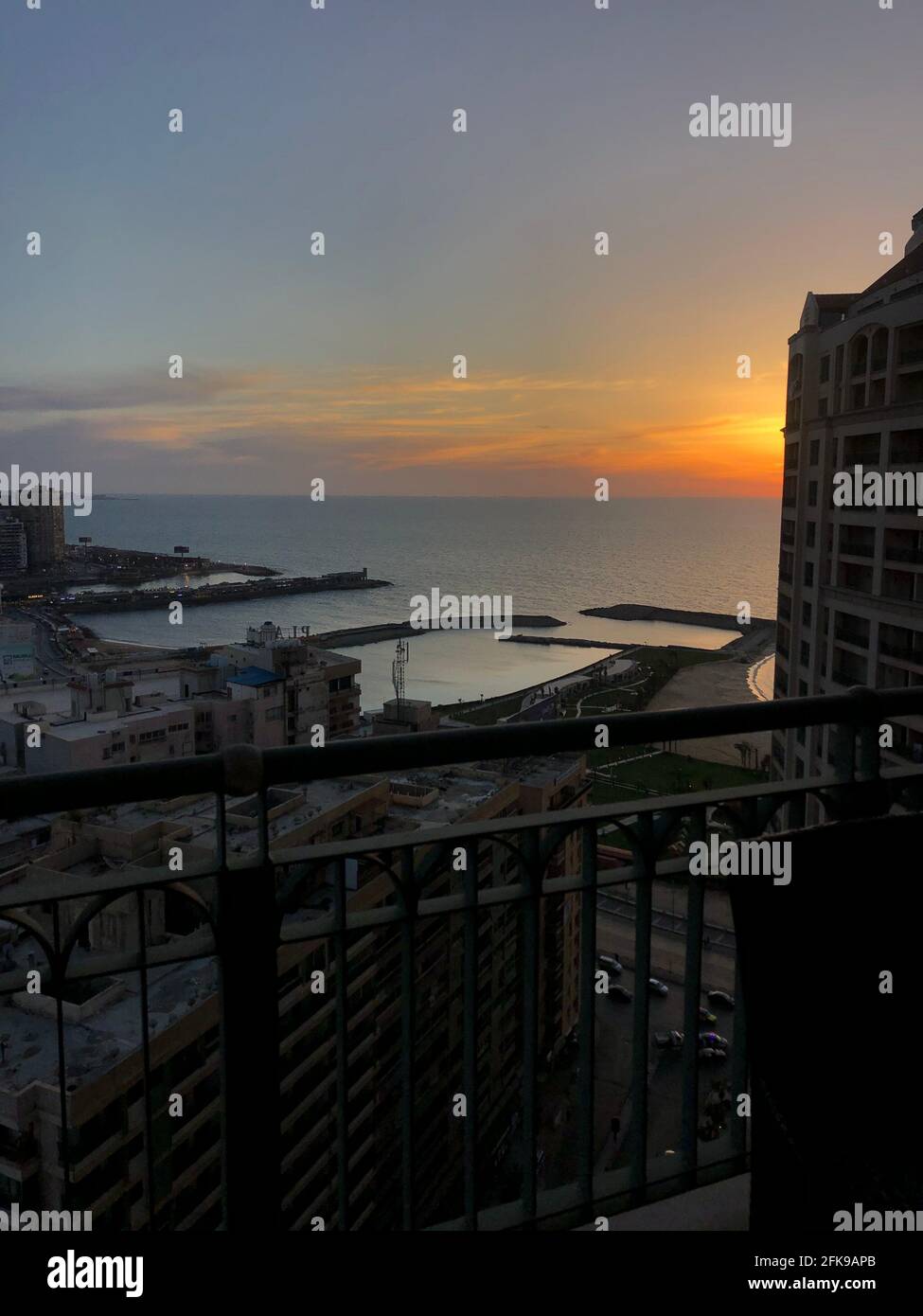 vertical view of a part of city Alexandria at sunset background ...