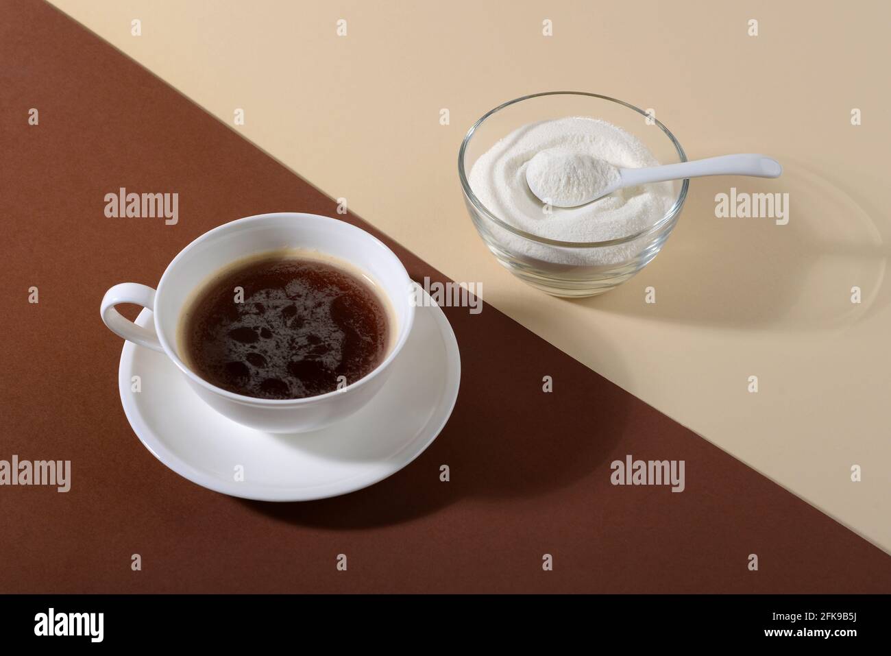 Collagen powder and cup of coffee on two tone background. Extra protein ...