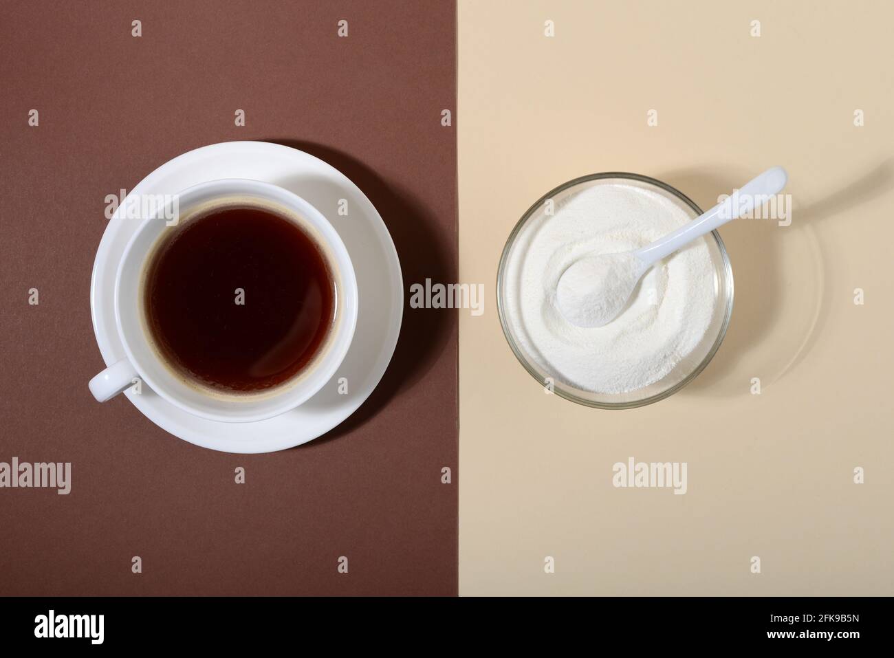 Collagen powder and cup of coffee on two tone background. Extra protein ...