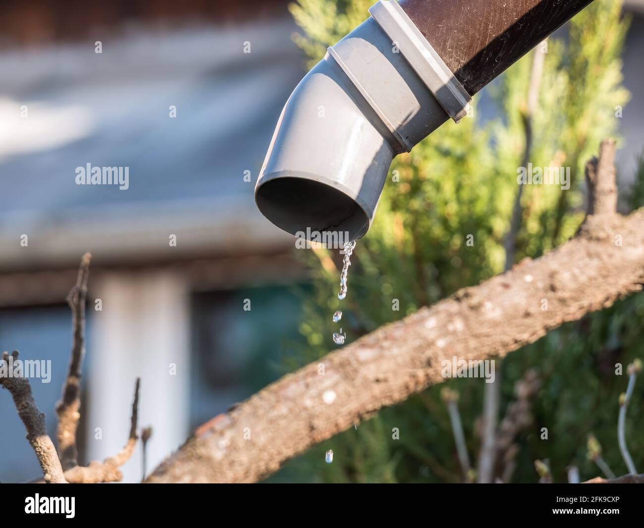 Water dripping from a drainpipe. Drain system installation Stock Photo ...