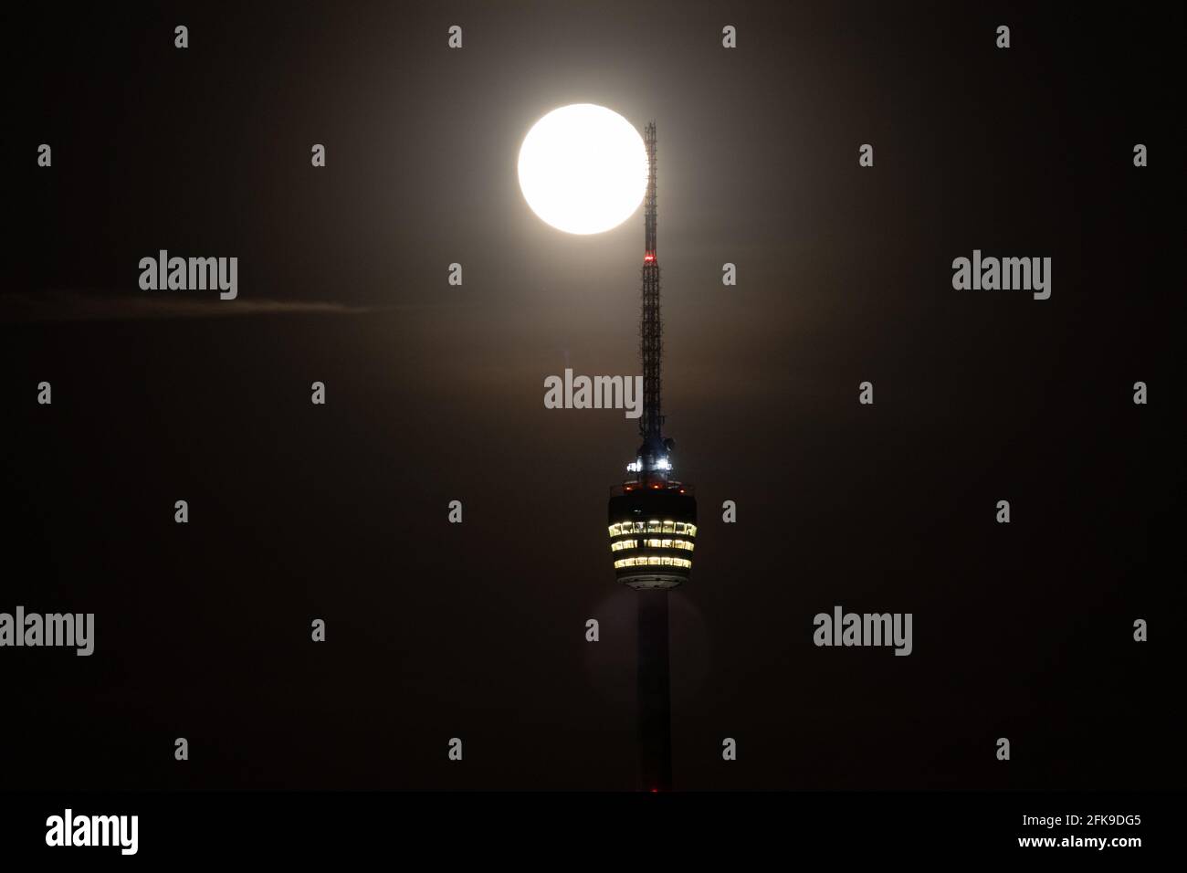 super full moon behind the Stuttgart TV Tower - the antenna is touching ...