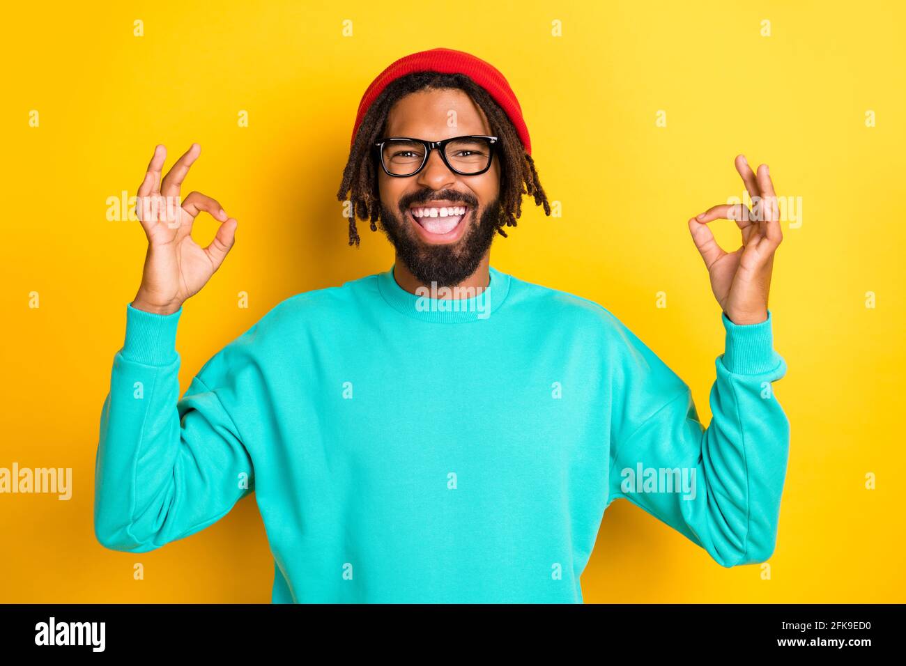 Photo of young african man happy positive smile show okey alright sign ...