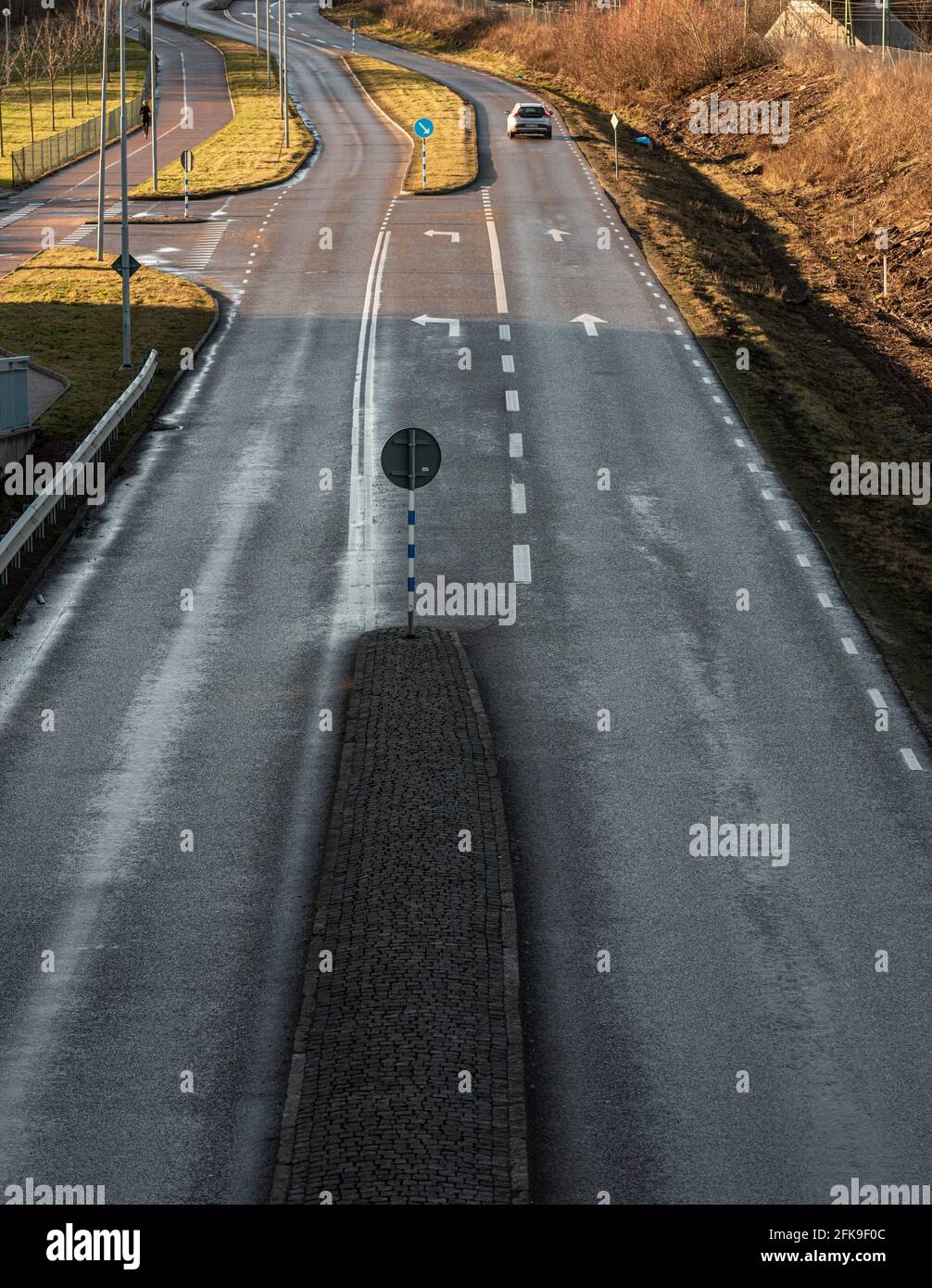 Empty road junction with one plus two lanes Stock Photo - Alamy