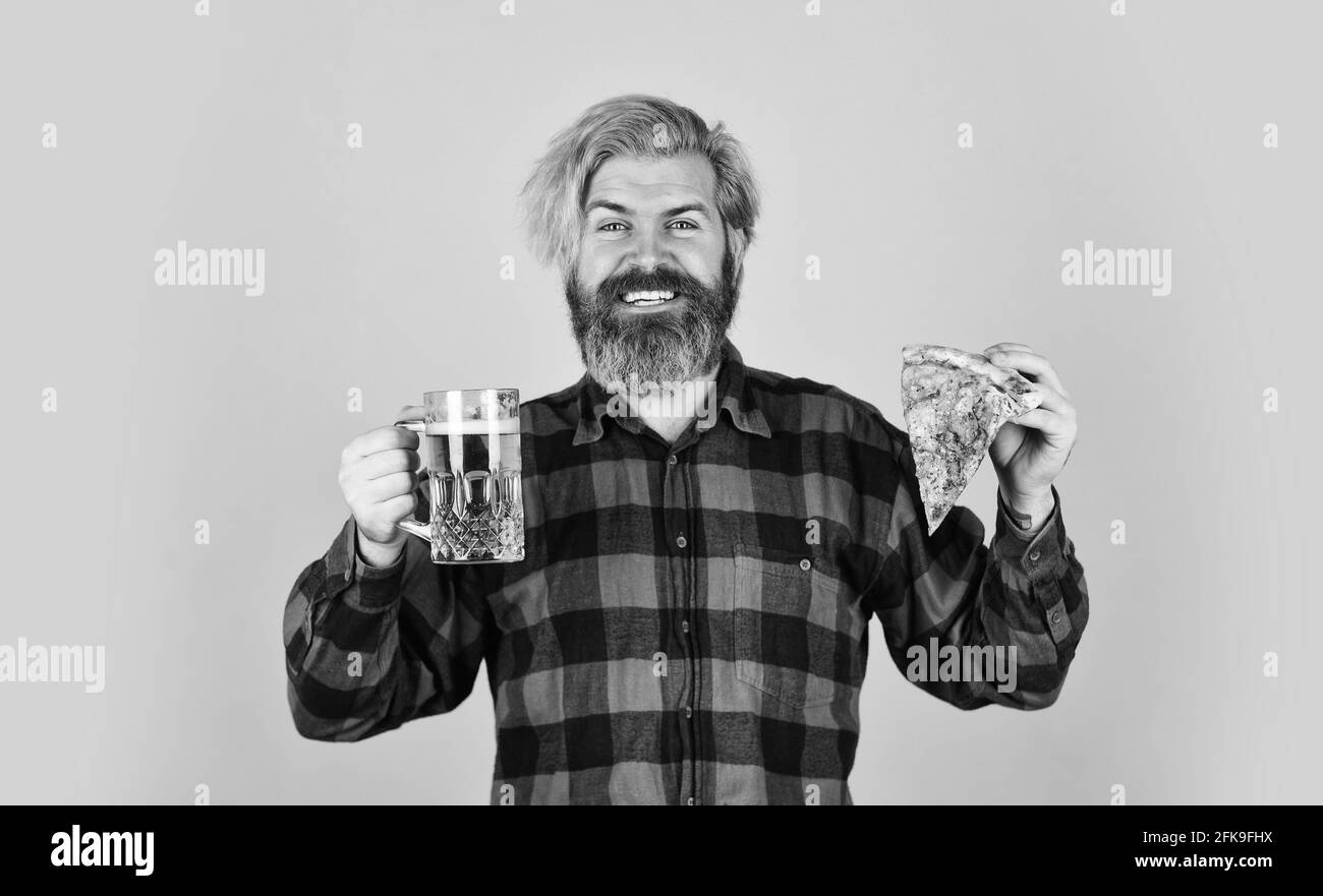 Cheers. glass of beer and pizza. watching football on TV. fast food ...