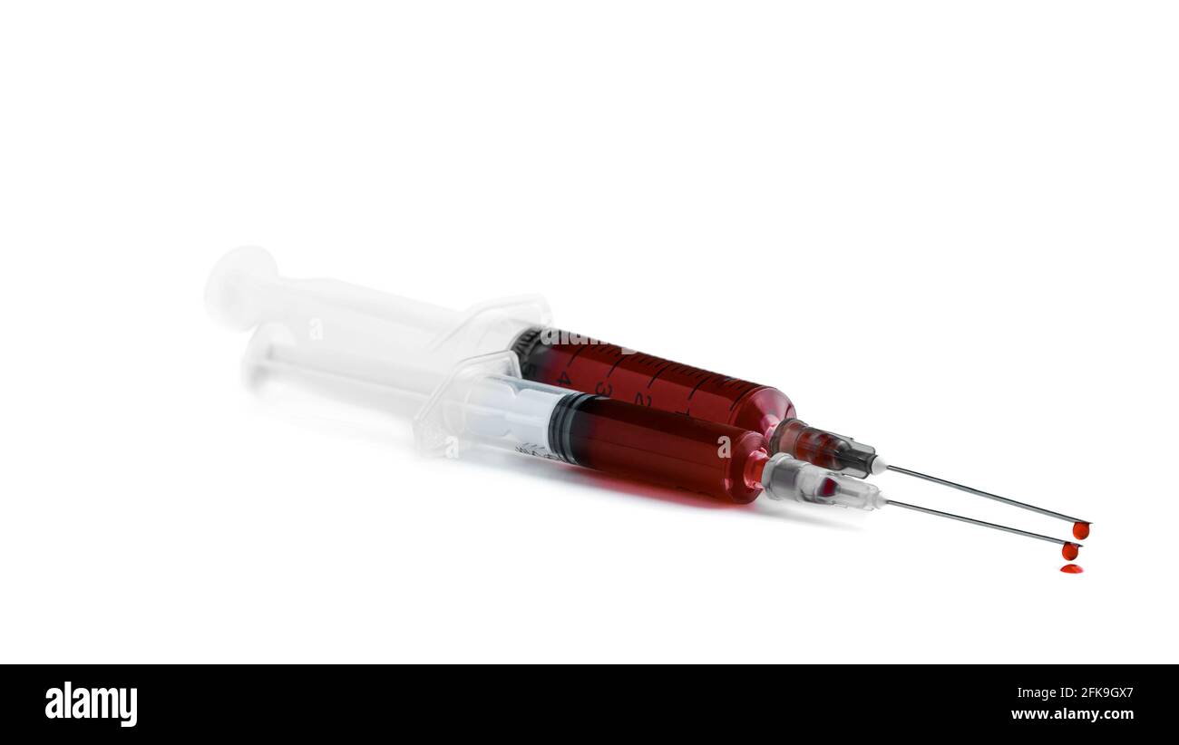 Syringes with red drop isolated on white background Stock Photo - Alamy