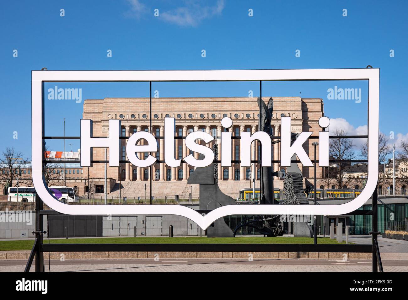 Parliament house behind Helsinki sign by Kansalaistori in Helsinki ...