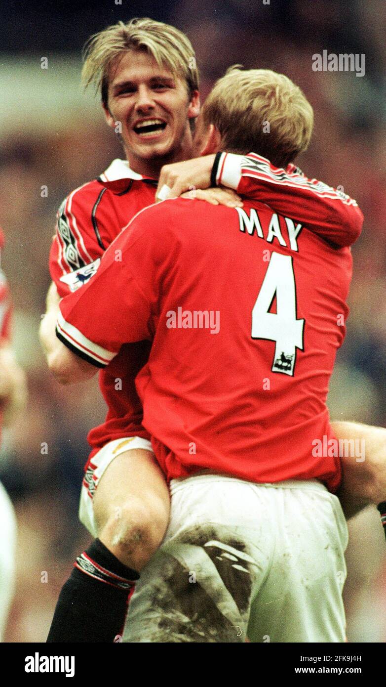 David Beckham celebrates with David May after Manchester United win the ...