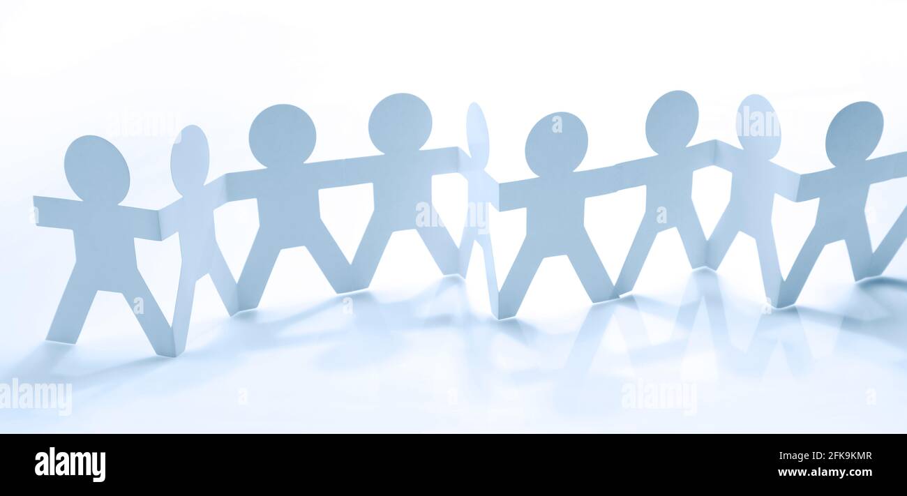 Team of paper chain people Stock Photo - Alamy