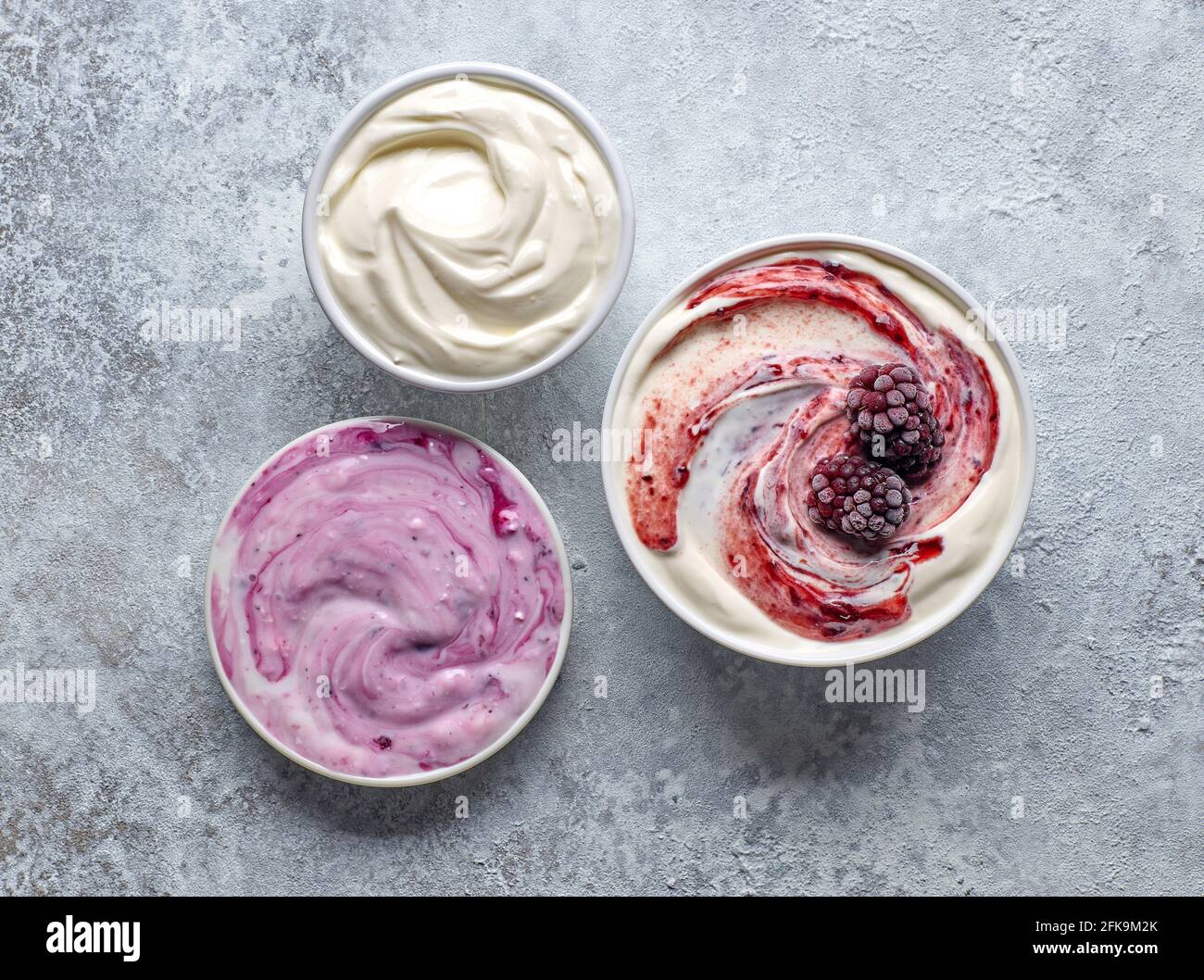 bowls of various yogurts, top view Stock Photo - Alamy