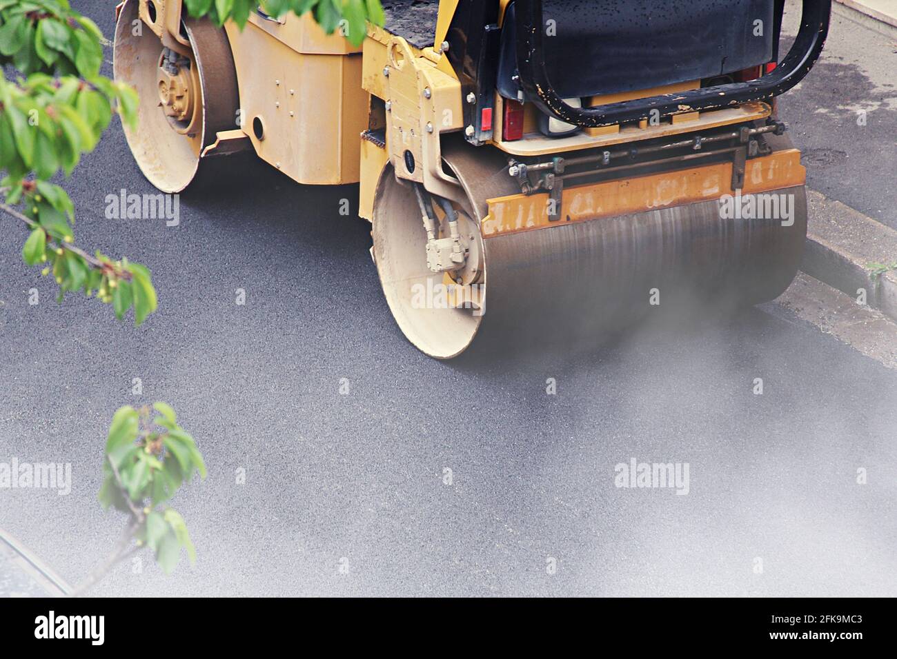 Top view of a machine while paving the road Stock Photo - Alamy
