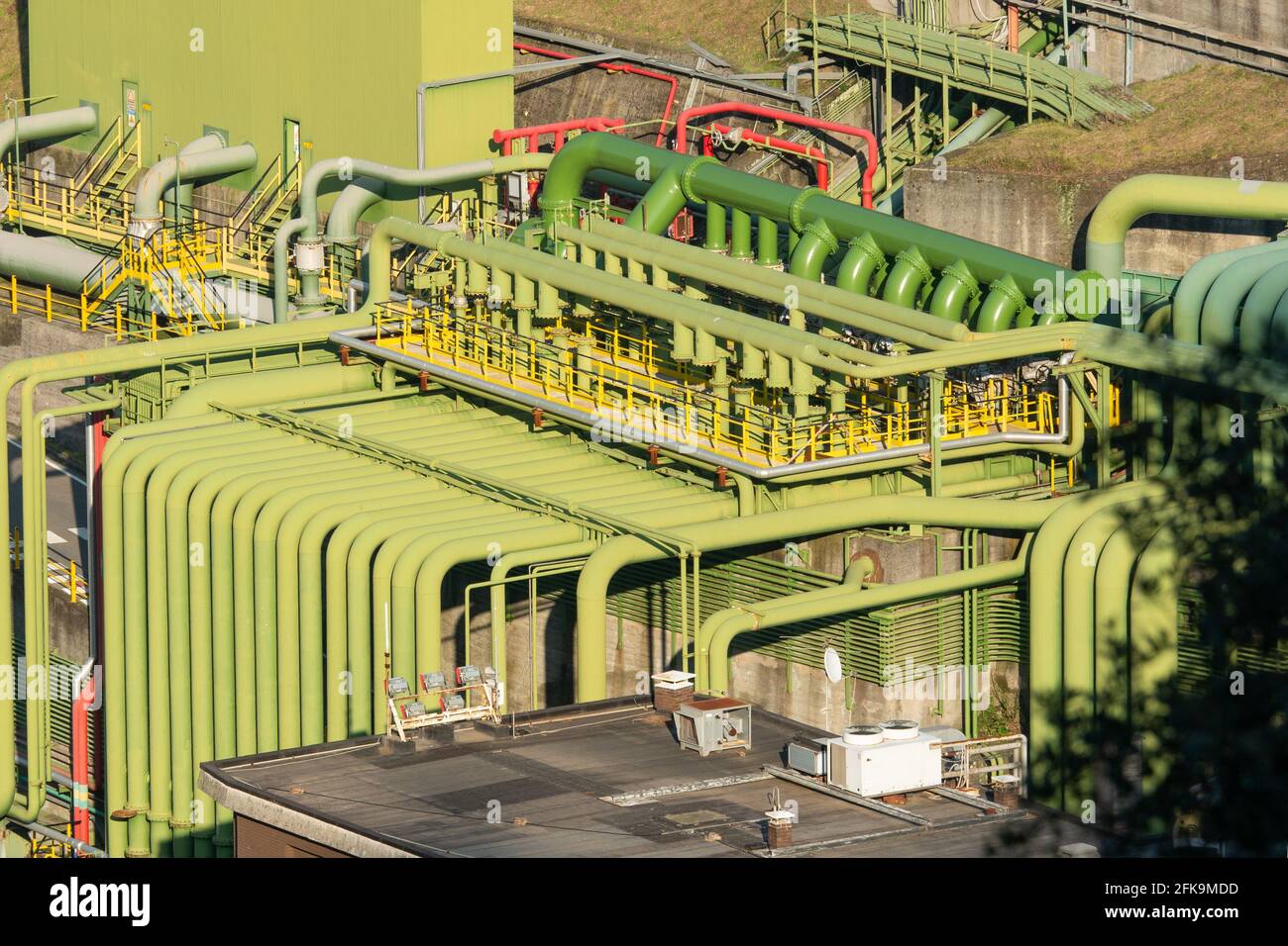 group of pipes painted in green detail of an oil and gas plant Stock ...