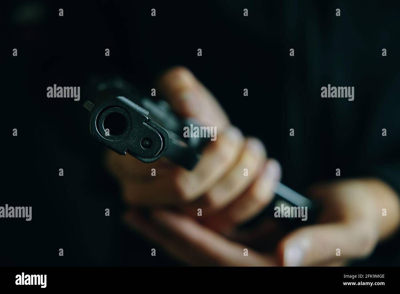 Muzzle of pistol close-up. Guy reloading gun. Weapon ammunition ...