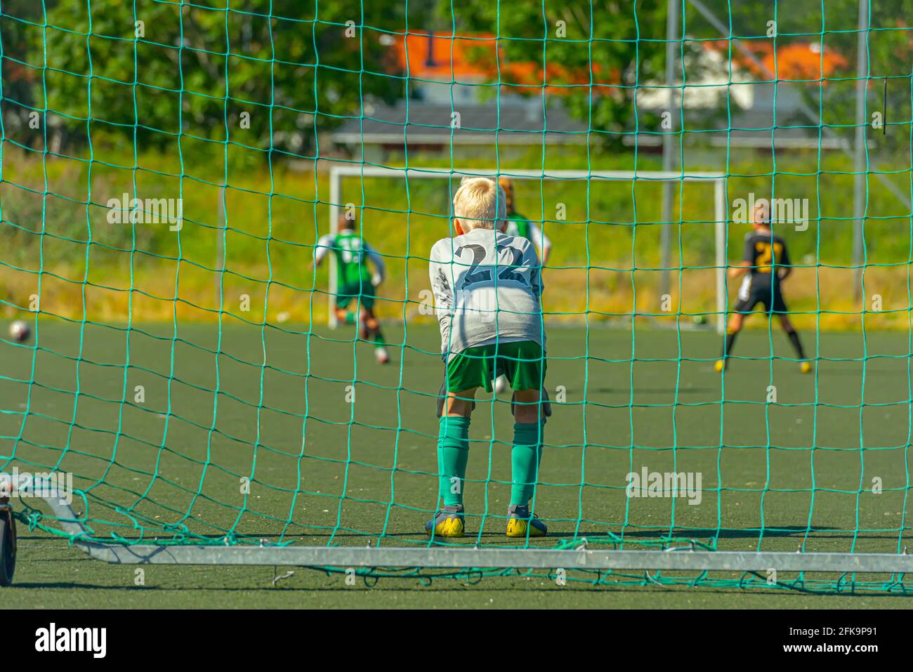 Kid being goal keeper in a soccer game Stock Photo - Alamy