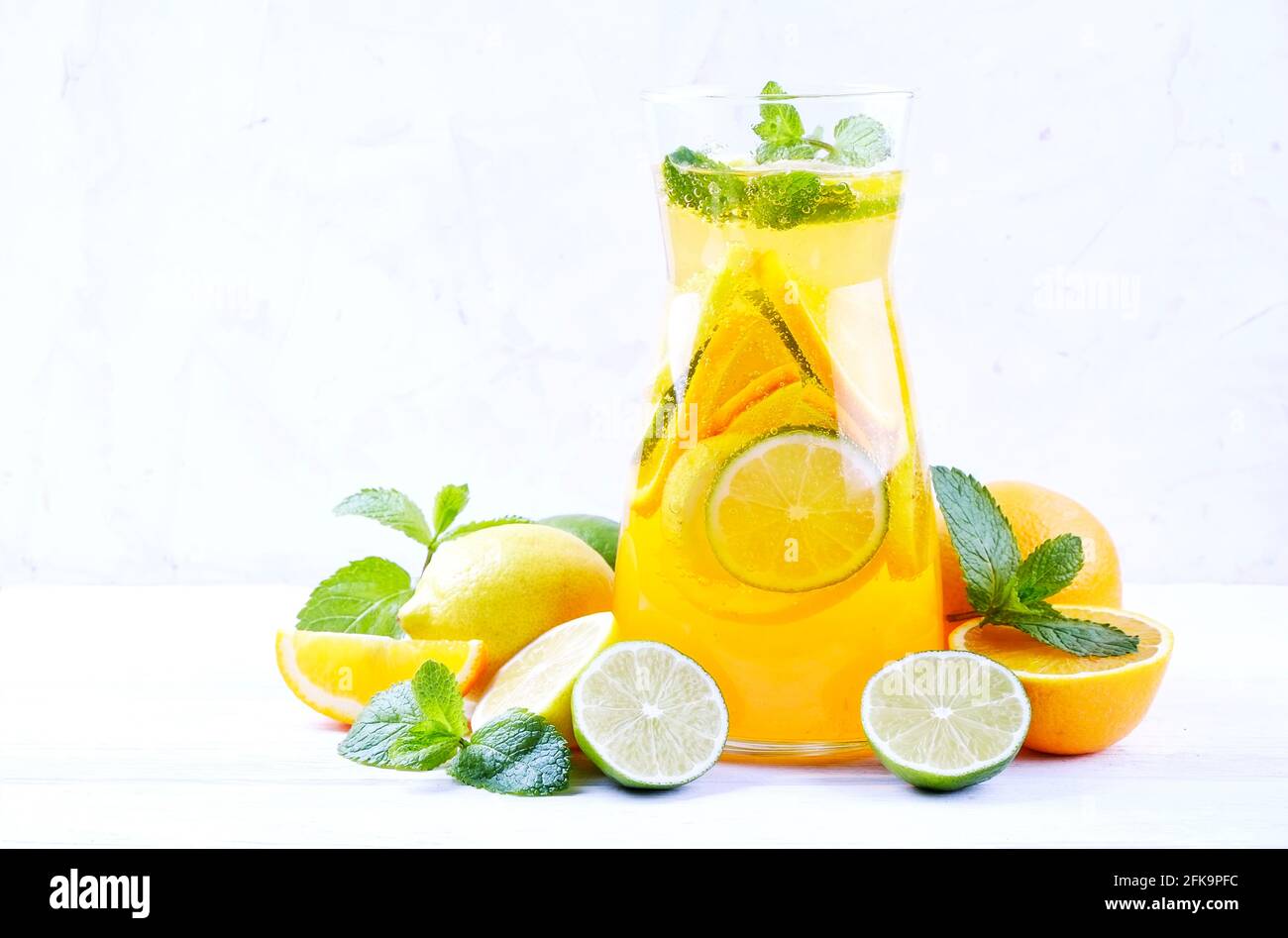 Two glasses & pitcher bottle of homemade refreshing lemonade with ...