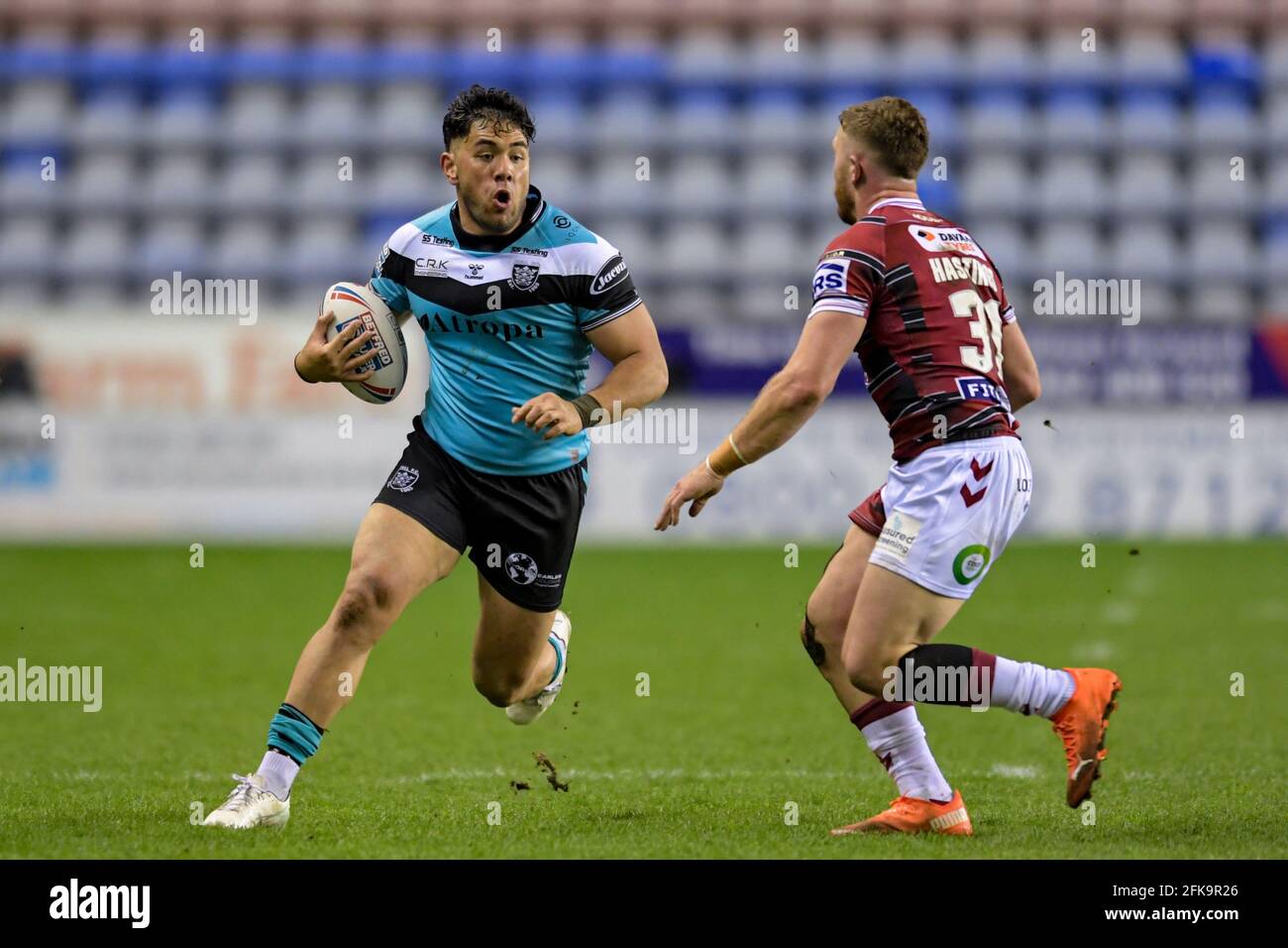 Wigan, UK. 29th Apr, 2021. Andre Savelio (11) of Hull FC looks for a ...