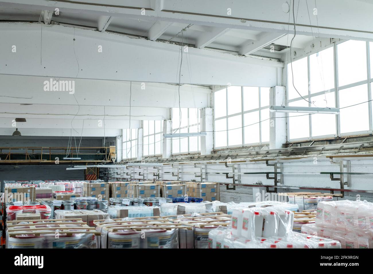 Large warehouse room with canisters and buckets wrapped into ...