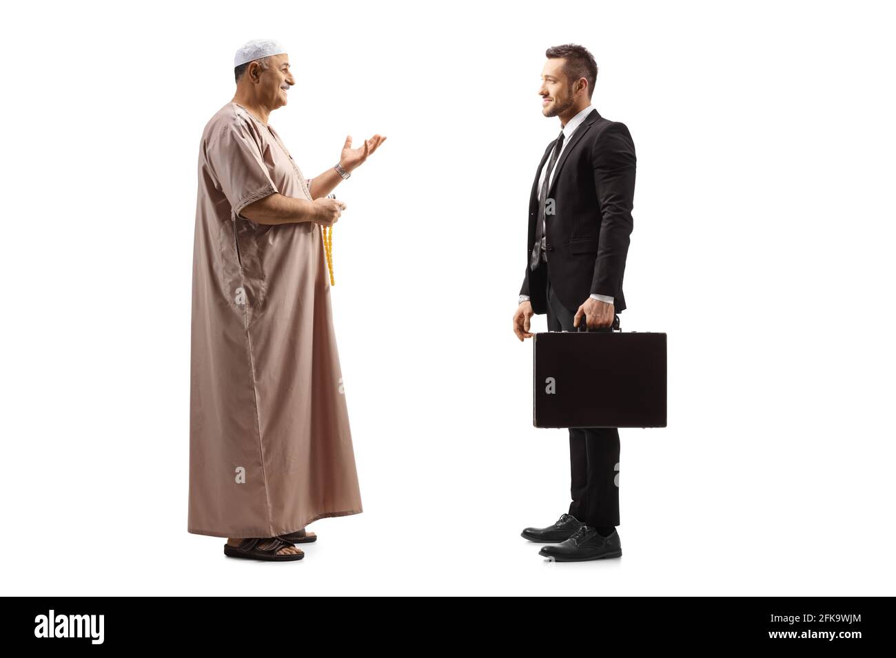 Full length profile shot of a muslim man talking to a businessman with ...