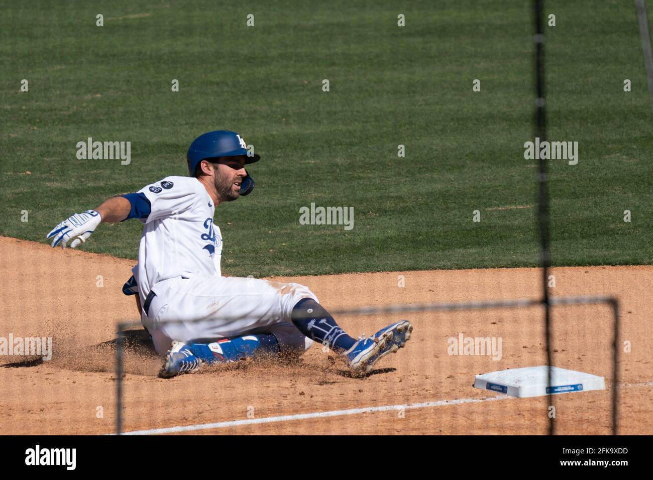Los Angeles Dodgers left fielder Chris Taylor (3) slides into third ...