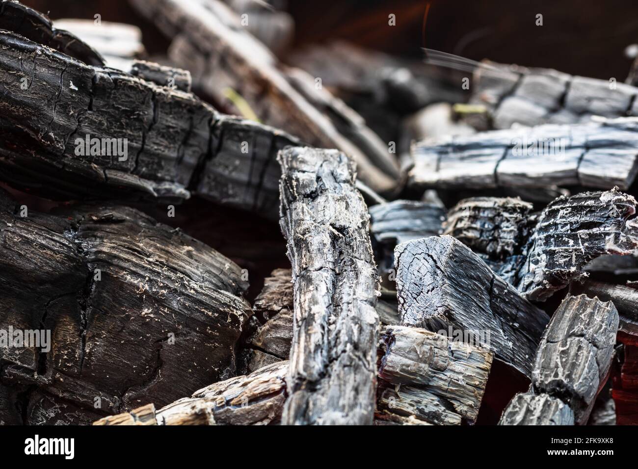 Burning wood chips forming coal. Barbecue preparation, fire before ...