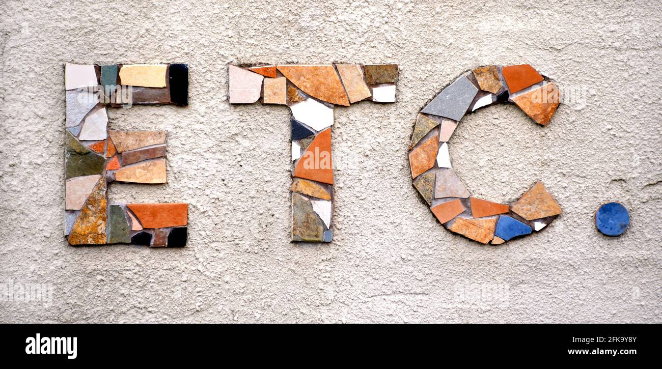 The word et cetera is formed from grouping broken tile into the letters ...