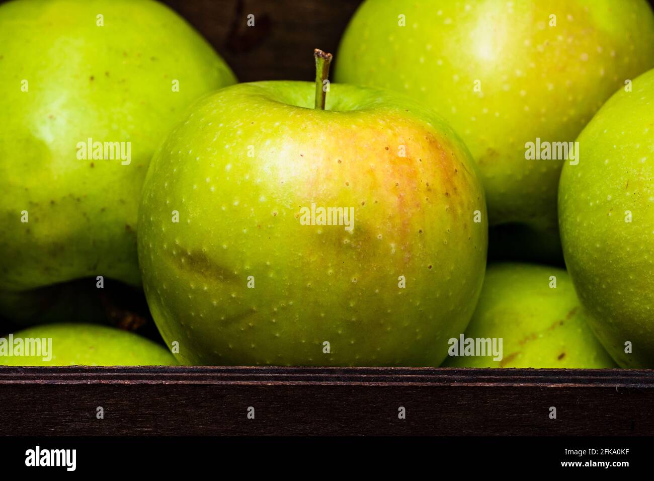 Ripe green apples in a wooden crate, close up isolated Stock Photo - Alamy