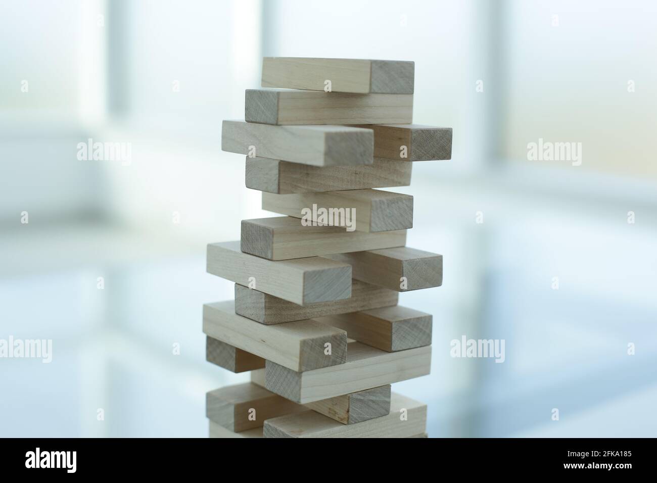 Blocks wood game jenga on white background Stock Photo - Alamy
