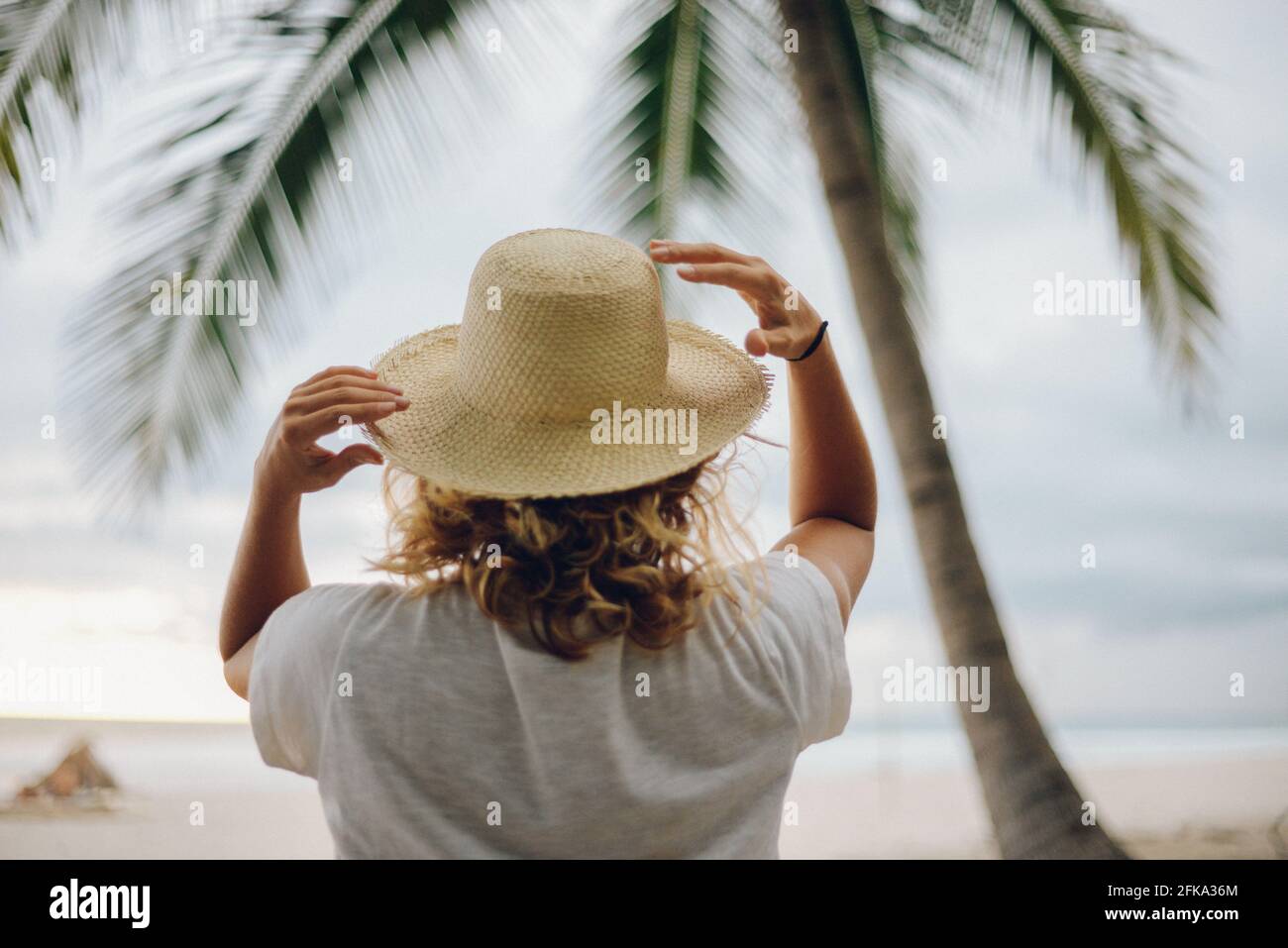 Wearing beach hat hi-res stock photography and images - Alamy