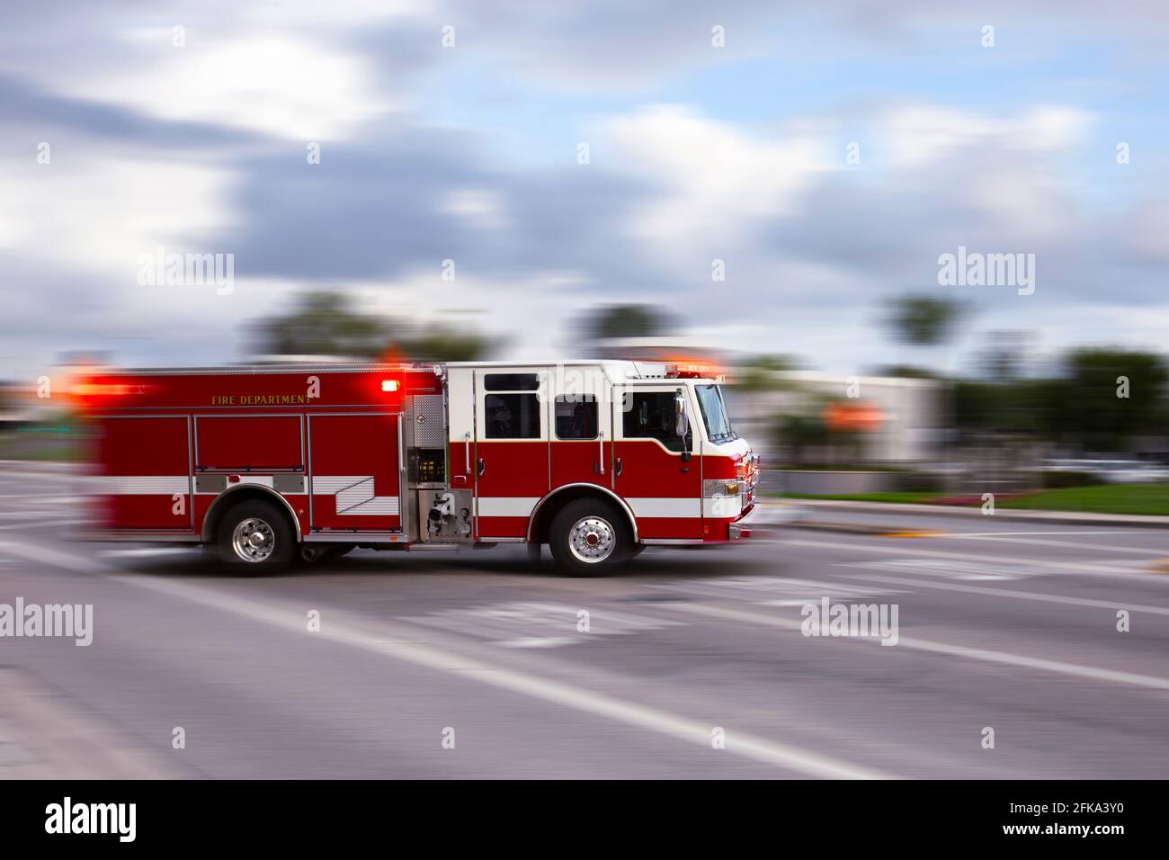 A fire engine responds to the scene of an emergency Stock Photo - Alamy