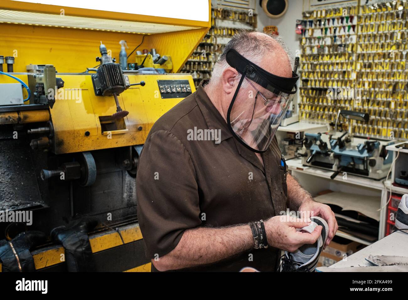 Man working a normal day. His job as a shoemaker Stock Photo - Alamy