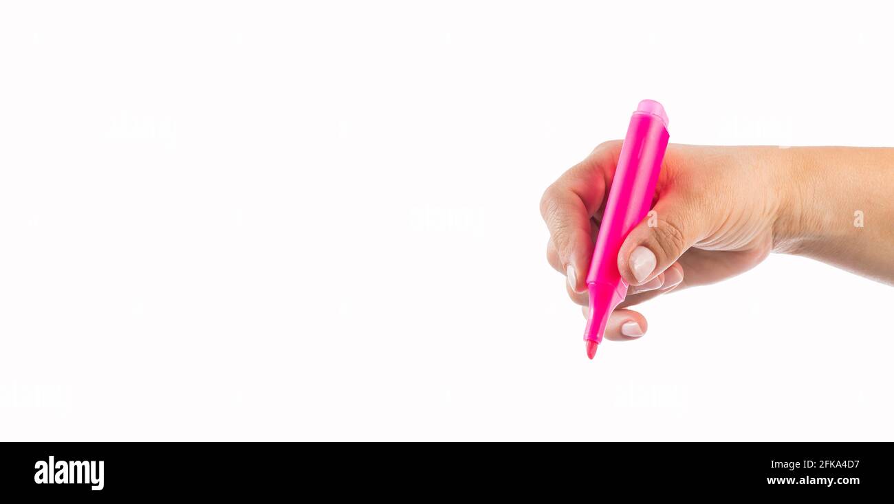 Hand holds pink highlighter - White background Stock Photo - Alamy