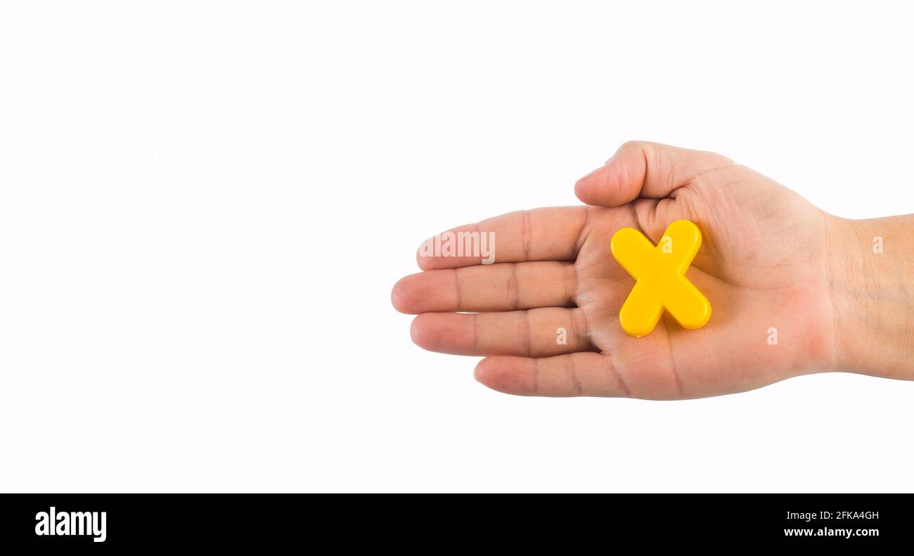 Multiplication operation symbol in hand - Text space Stock Photo - Alamy