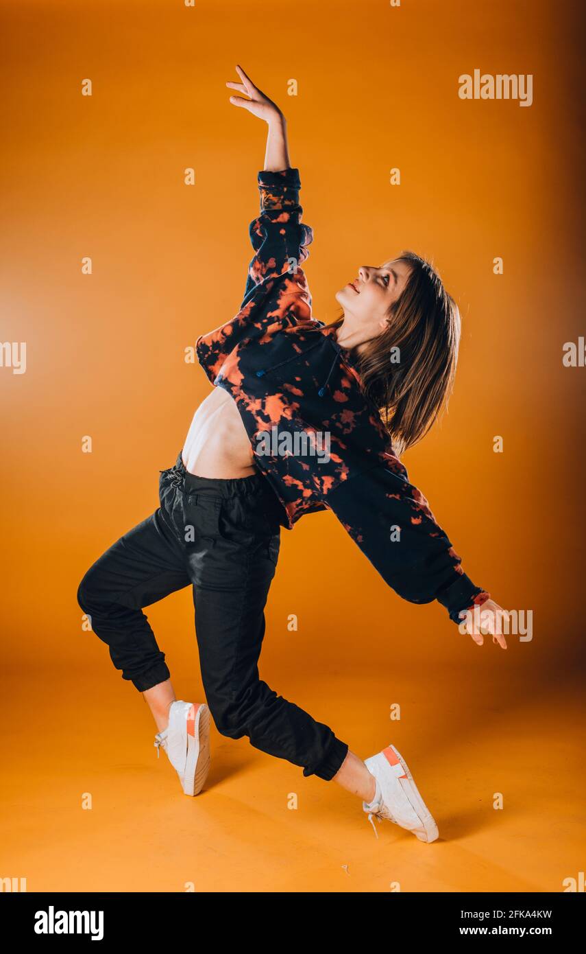 Artistic modern dancer practicing dancing moves in the studio Stock ...