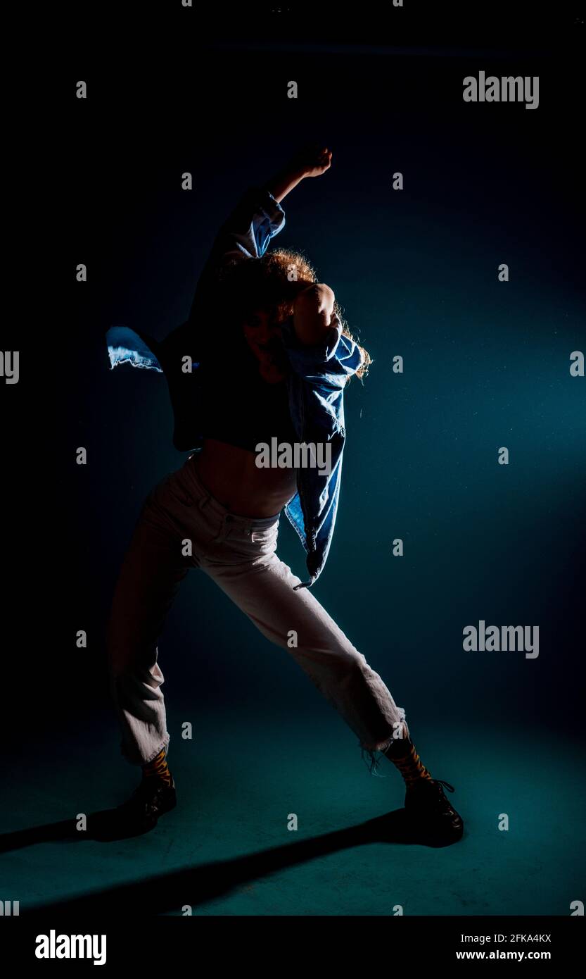 Dance moves performed by an acrobatic flexible female dancer dancing in ...