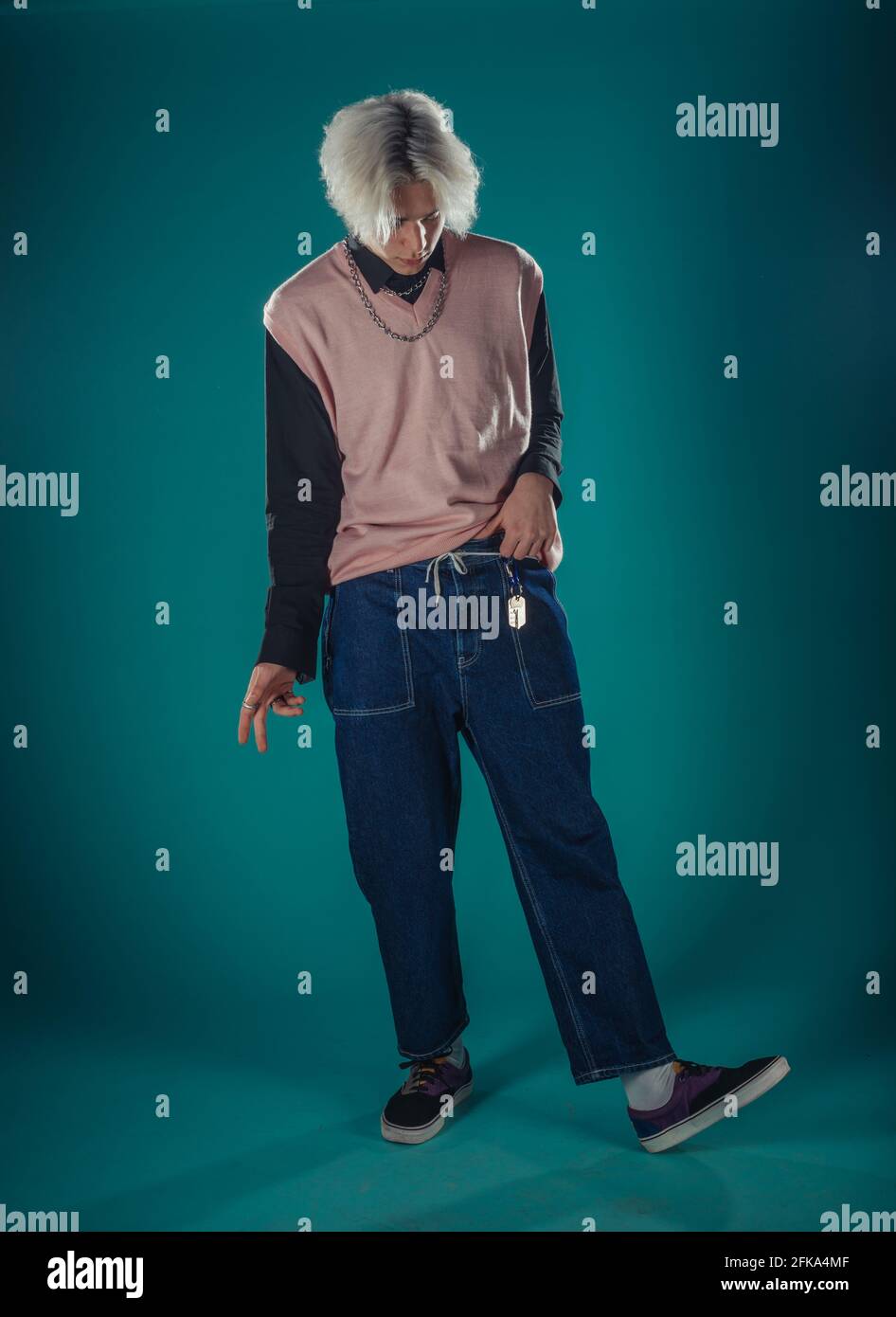 Young adult man in casual outfit wear looking at camera, holding ...