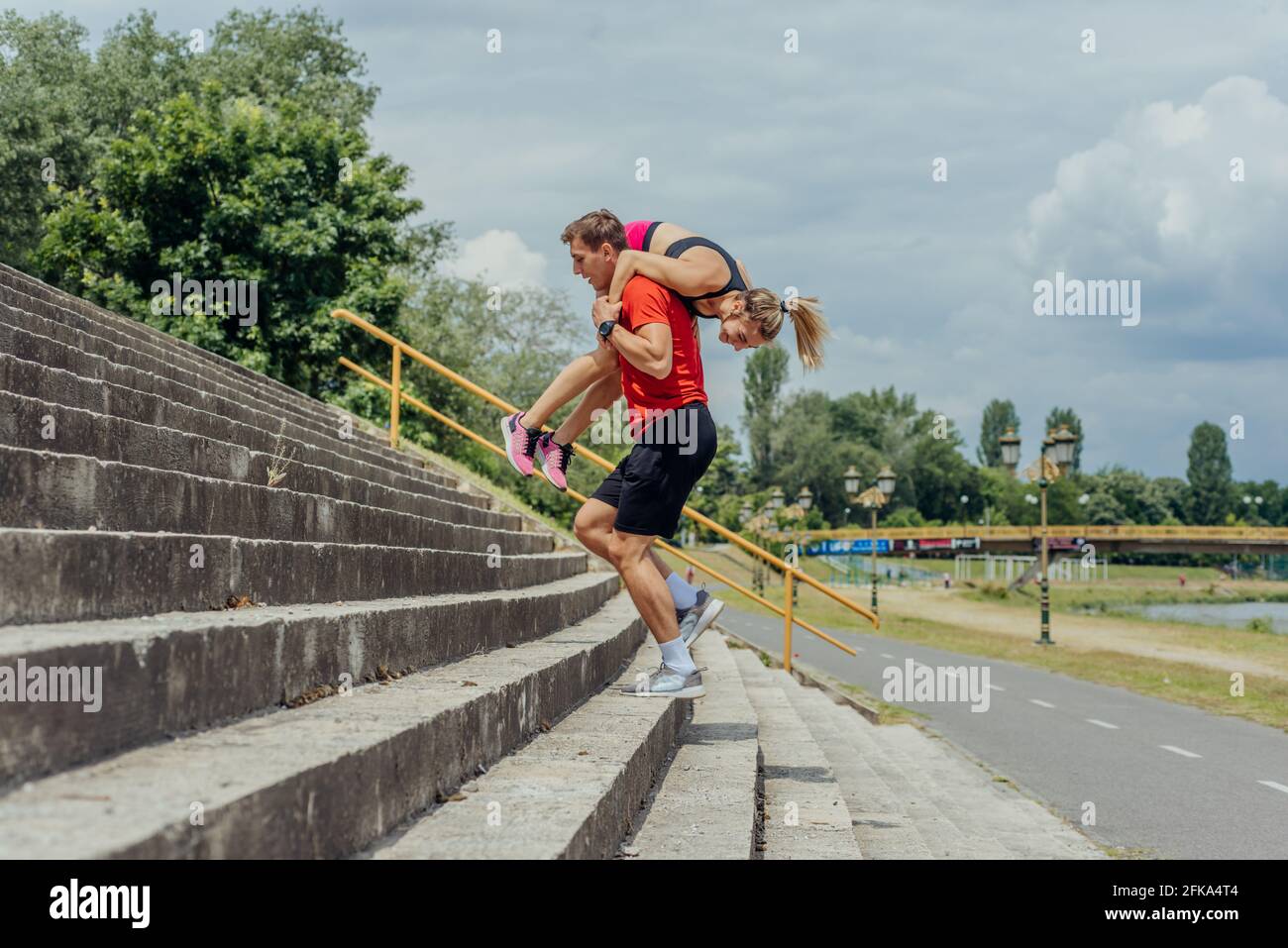Two friends run up stairs hi-res stock photography and images - Alamy