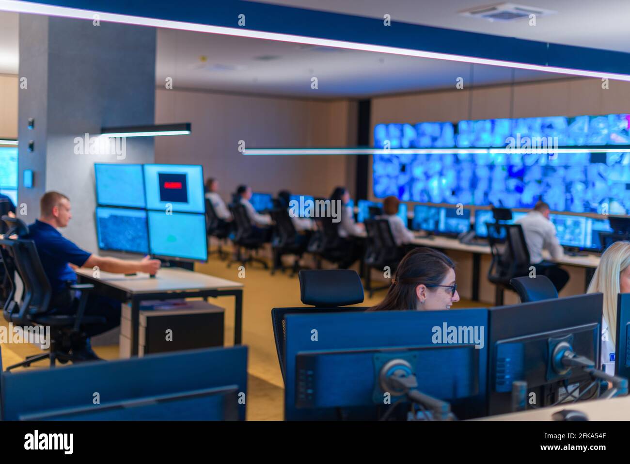 Male computer operator monitoring from a security ( computer, logistic ...