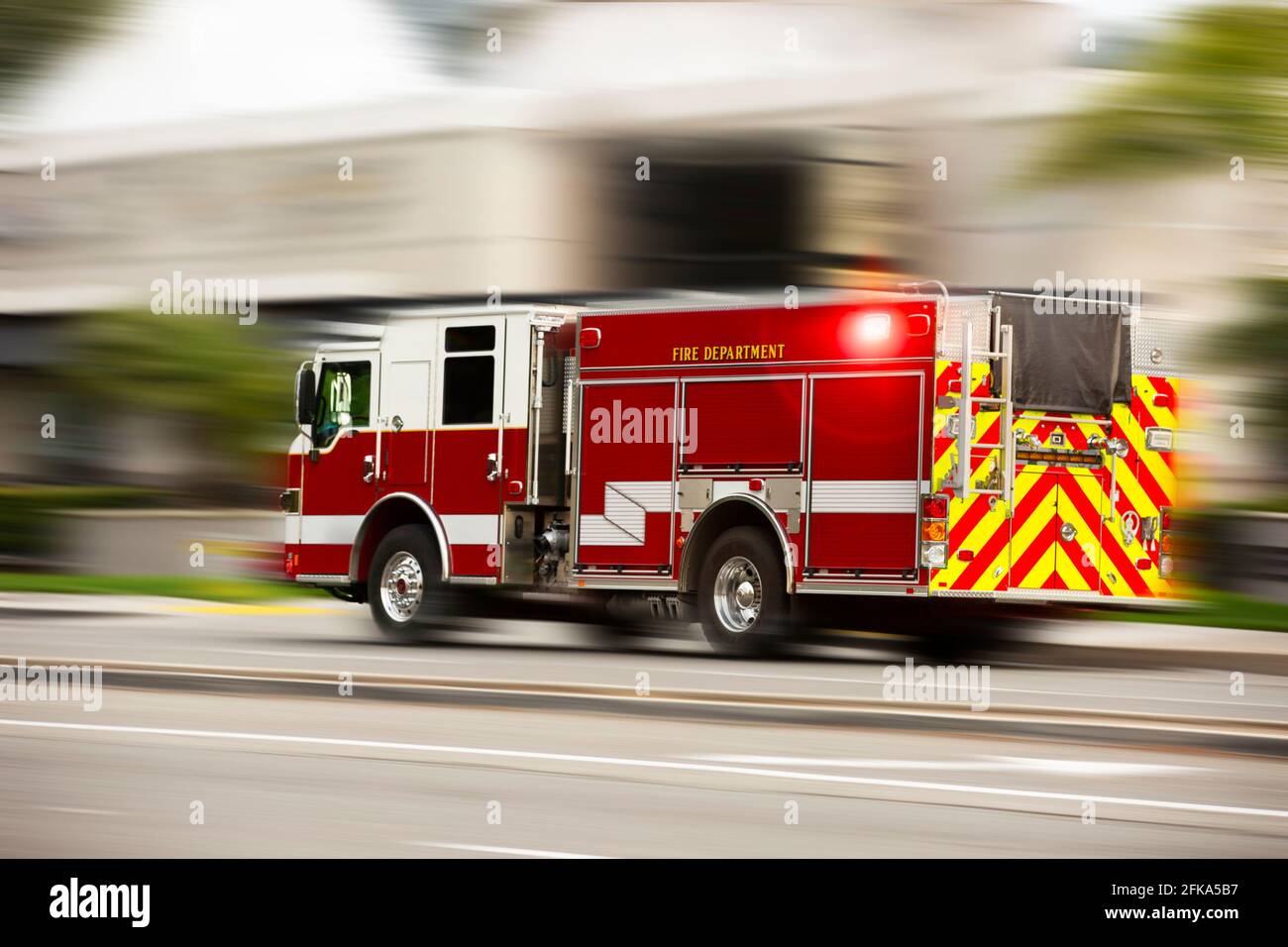 A fire engine responds to the scene of an emergency Stock Photo - Alamy