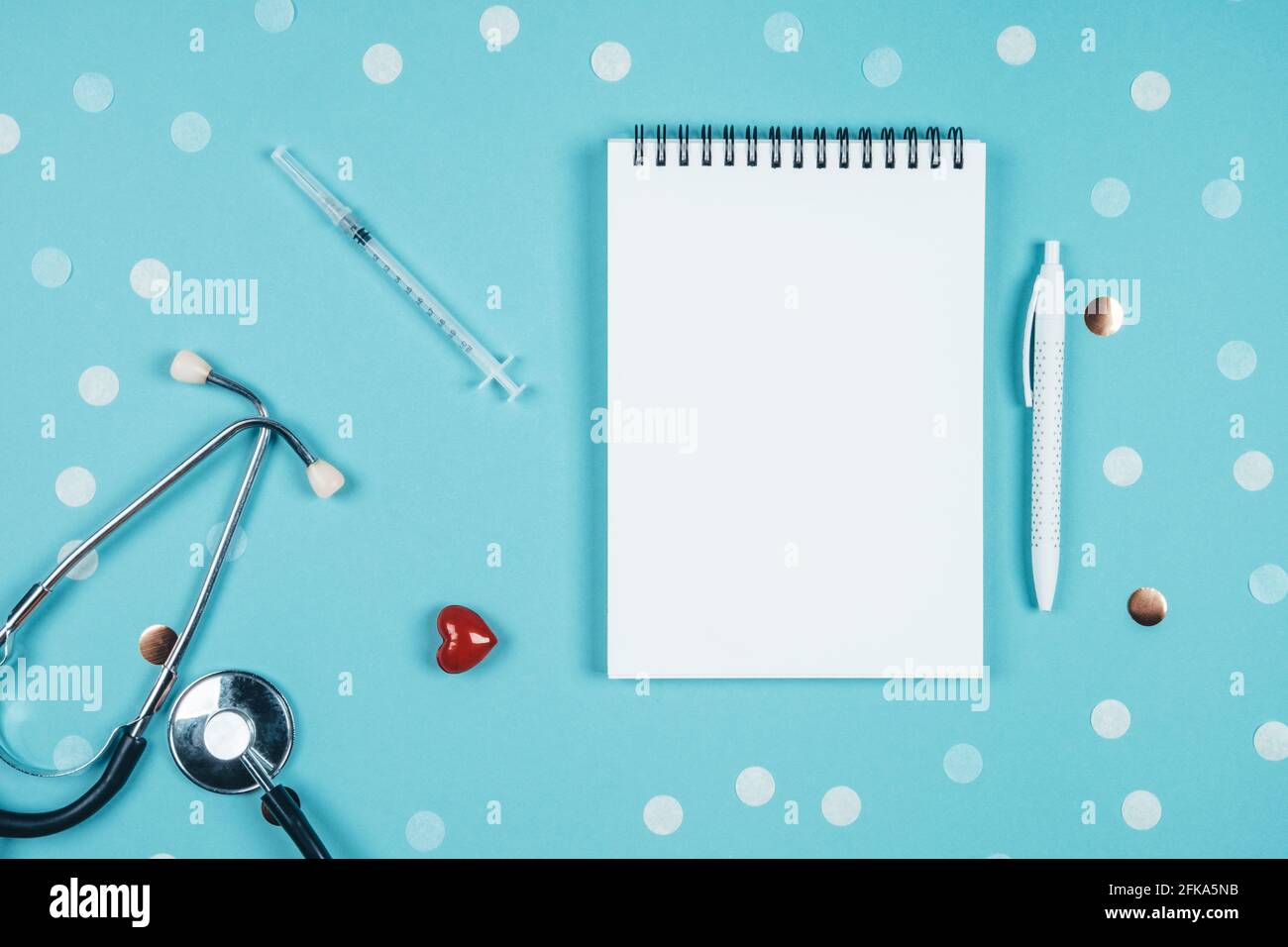 White sheet, medical instruments and flowers on a blue background Stock ...