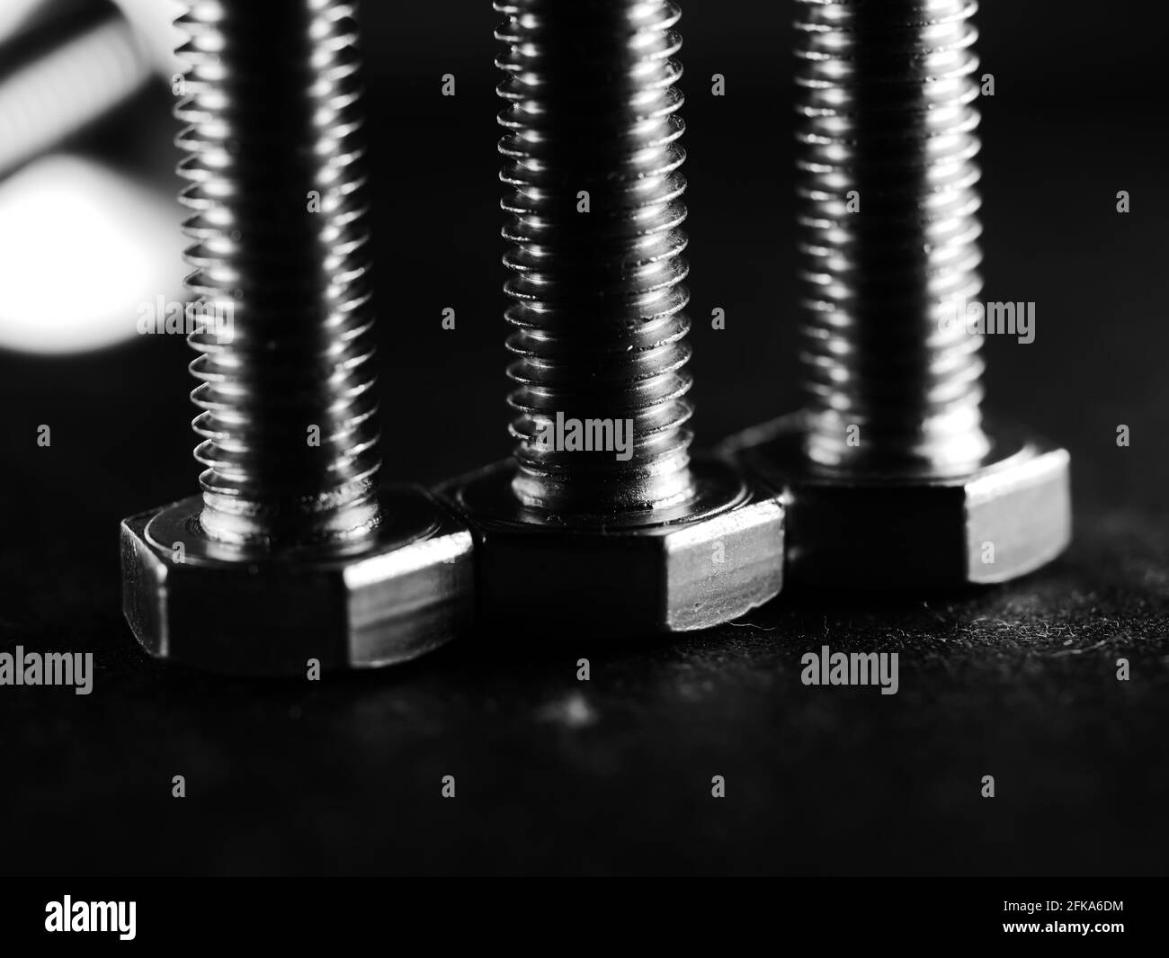 Closeu shot of metal screw threads isolated on the black background ...