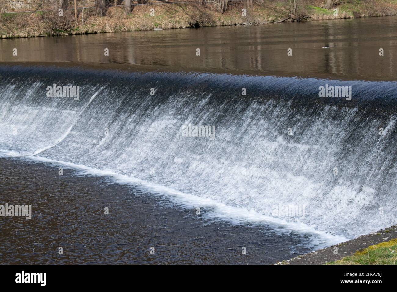 Small dam in an industrial area Stock Photo - Alamy