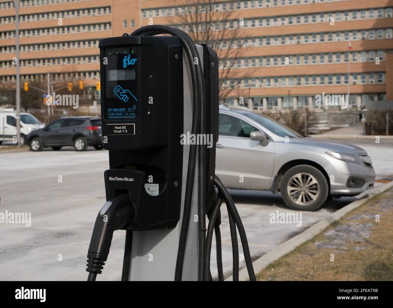 A charging station for an electric car in an office building parking ...
