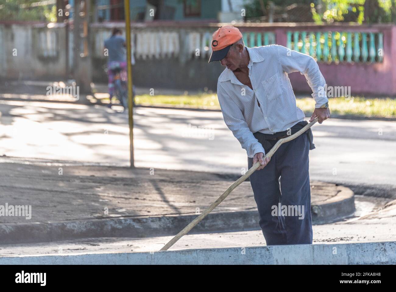 Man sweeping street hi-res stock photography and images - Alamy