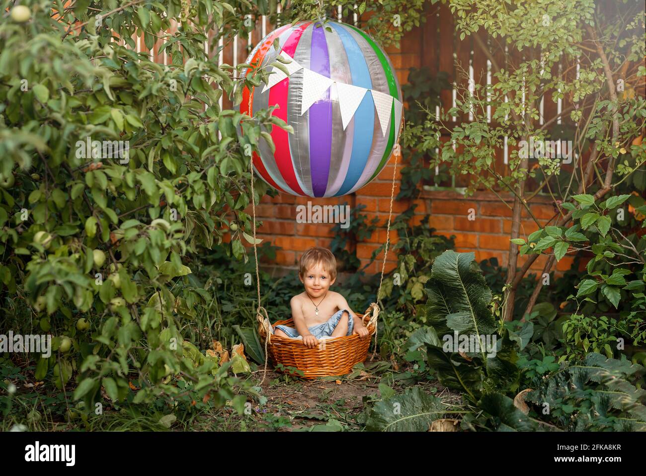Kid riding hot air balloon. Cute child on airship. Hot air balloon ...