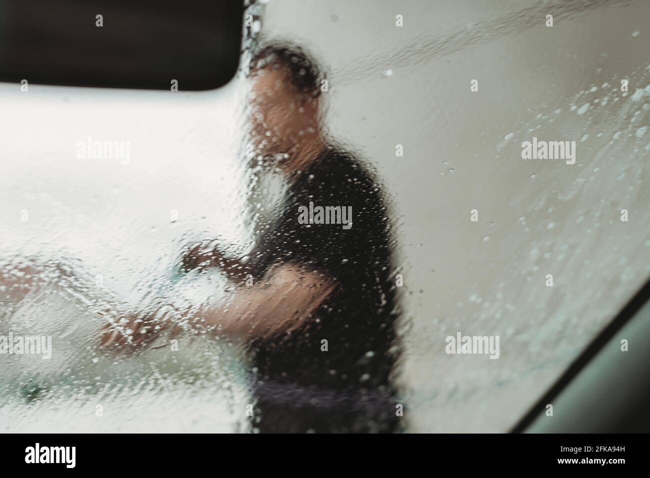 Man standing behind car hi-res stock photography and images - Alamy