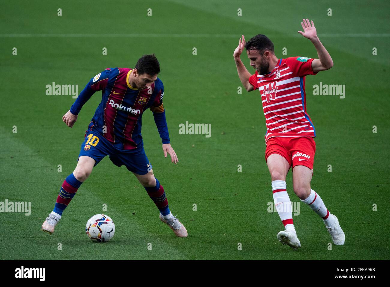 Barcelona, Spain. 29th Apr, 2021. Barcelona's Lionel Messi (L) vies for ...