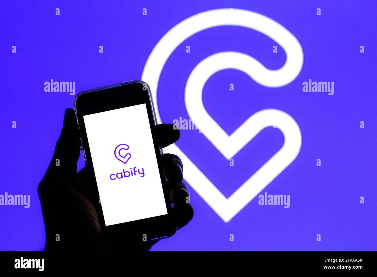 In this photo illustration a Cabify logo seen displayed on a smartphone ...