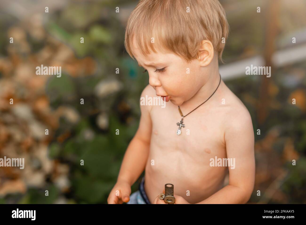 Surprised toddler boy child outside. Portrait of a cute little boy ...